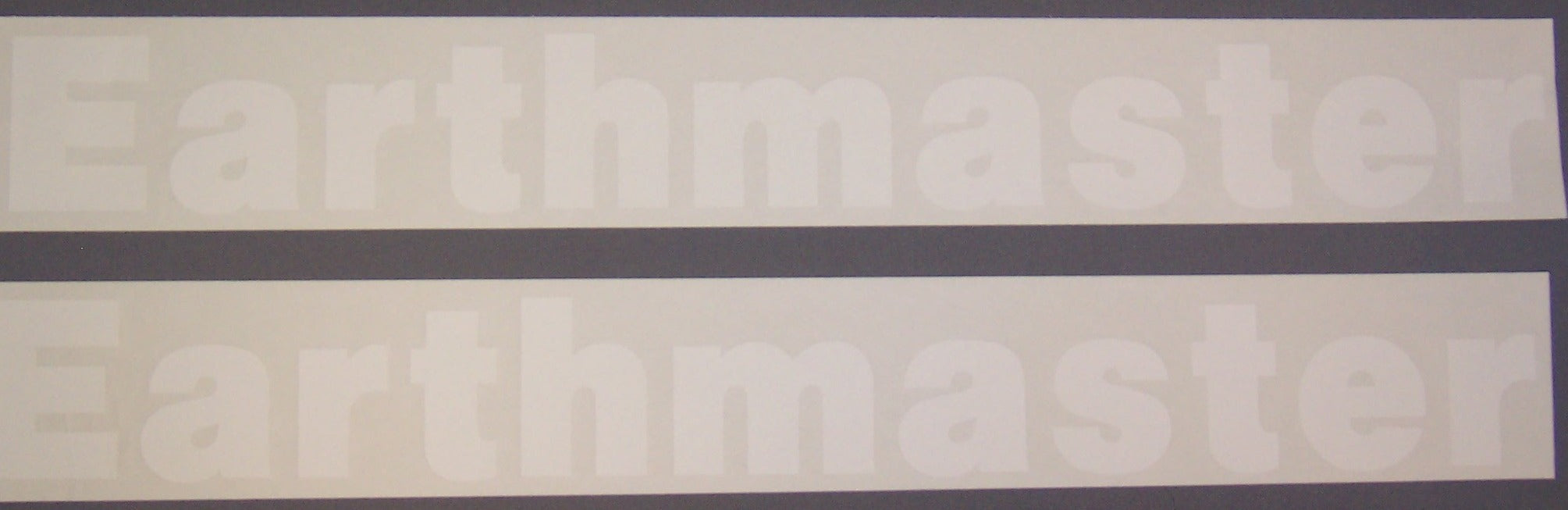 "Earthmaster", white vinyl cut decals – Binder Books